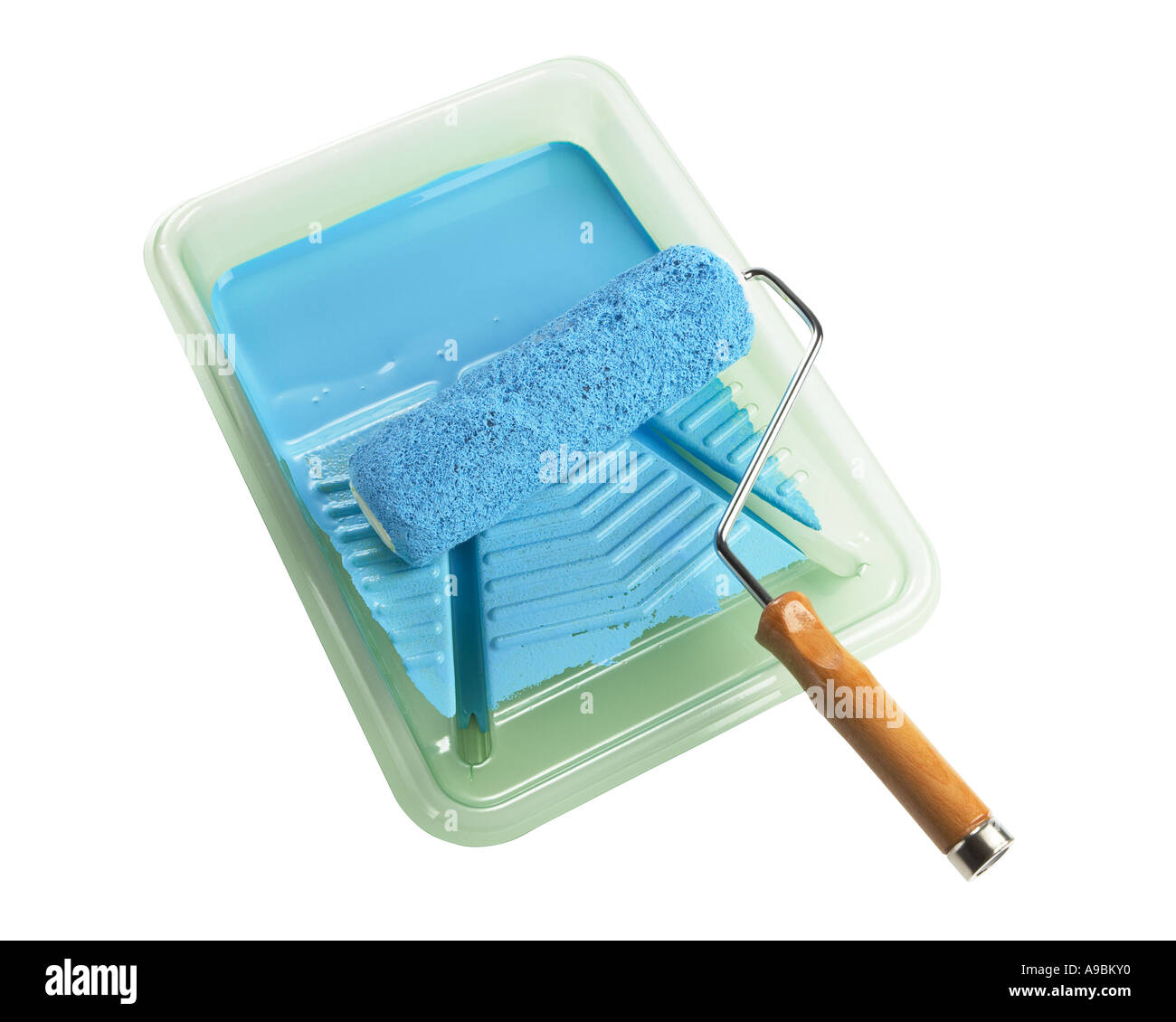 Blue paint in tray with roller brush on white background with clipping ...