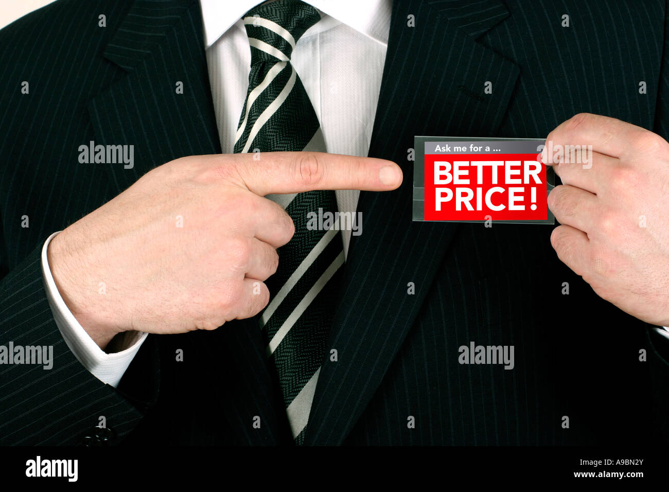 Sales person pointing to a badge offering a special price Stock Photo ...