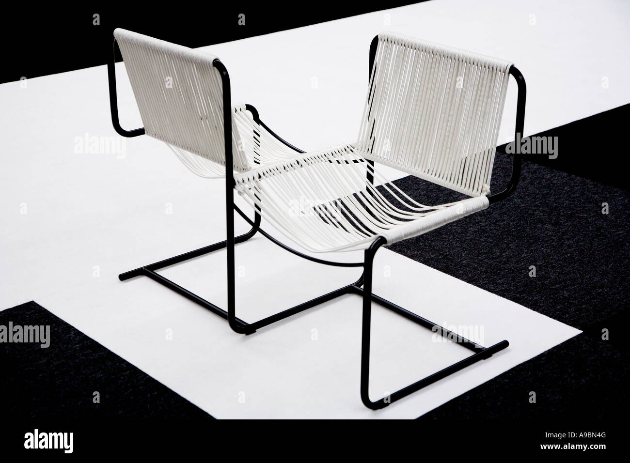 Designer chairs for two Stock Photo - Alamy