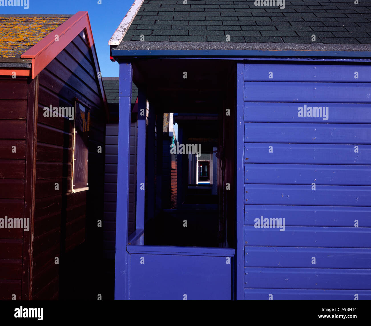 Beach huts moved to a car park for the winter to protect them from the ...