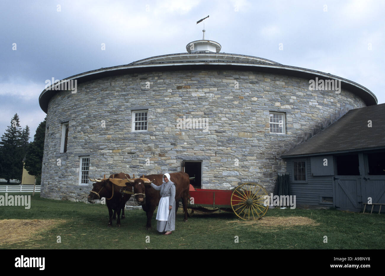 Shaker woman shows produce in the kitchen garden at the Hancock,Shaker ...