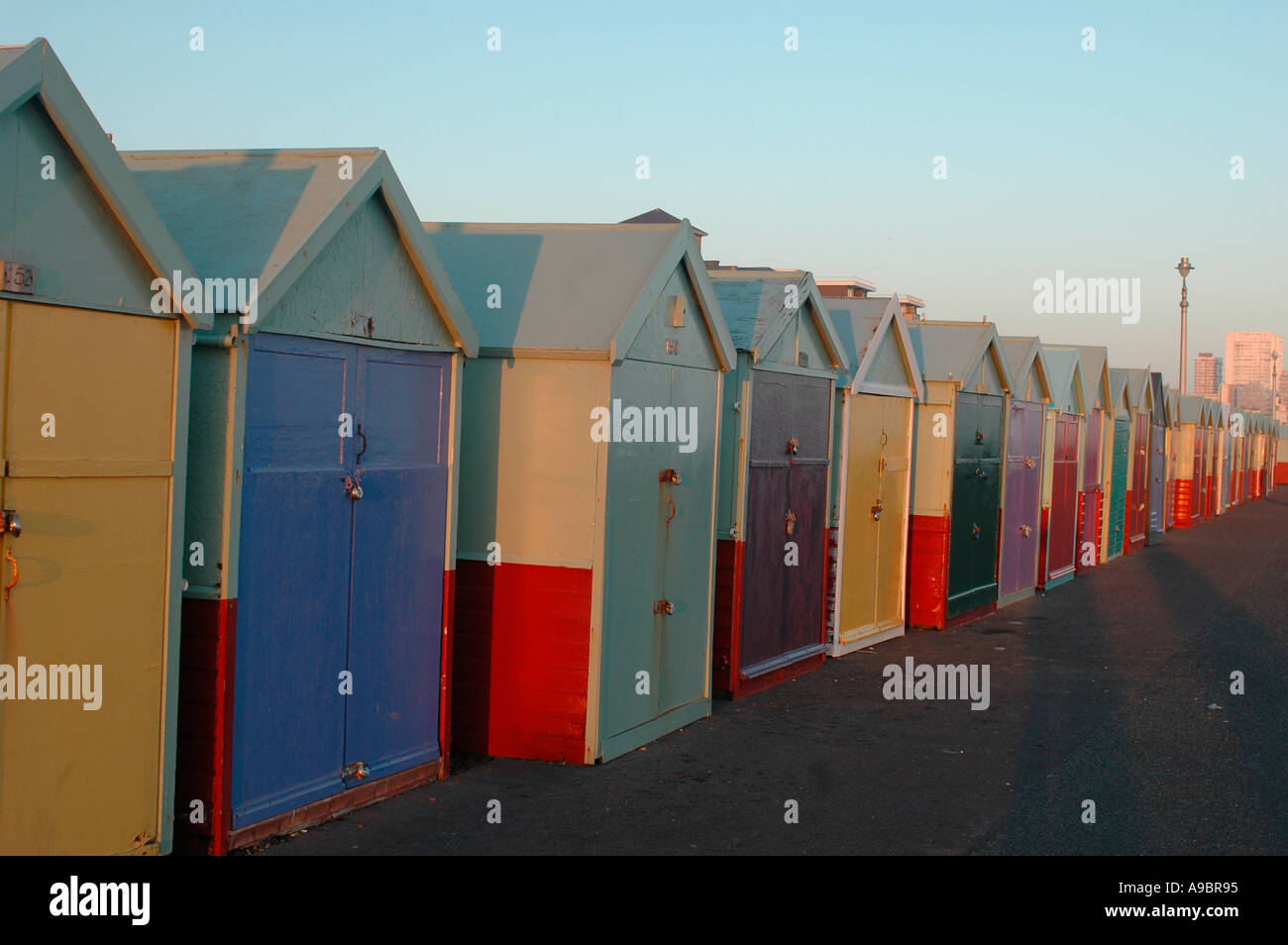 SUNSET ILLUMINATING BEACH HUTS ON BRIGHTON SEA FRONT Stock Photo - Alamy
