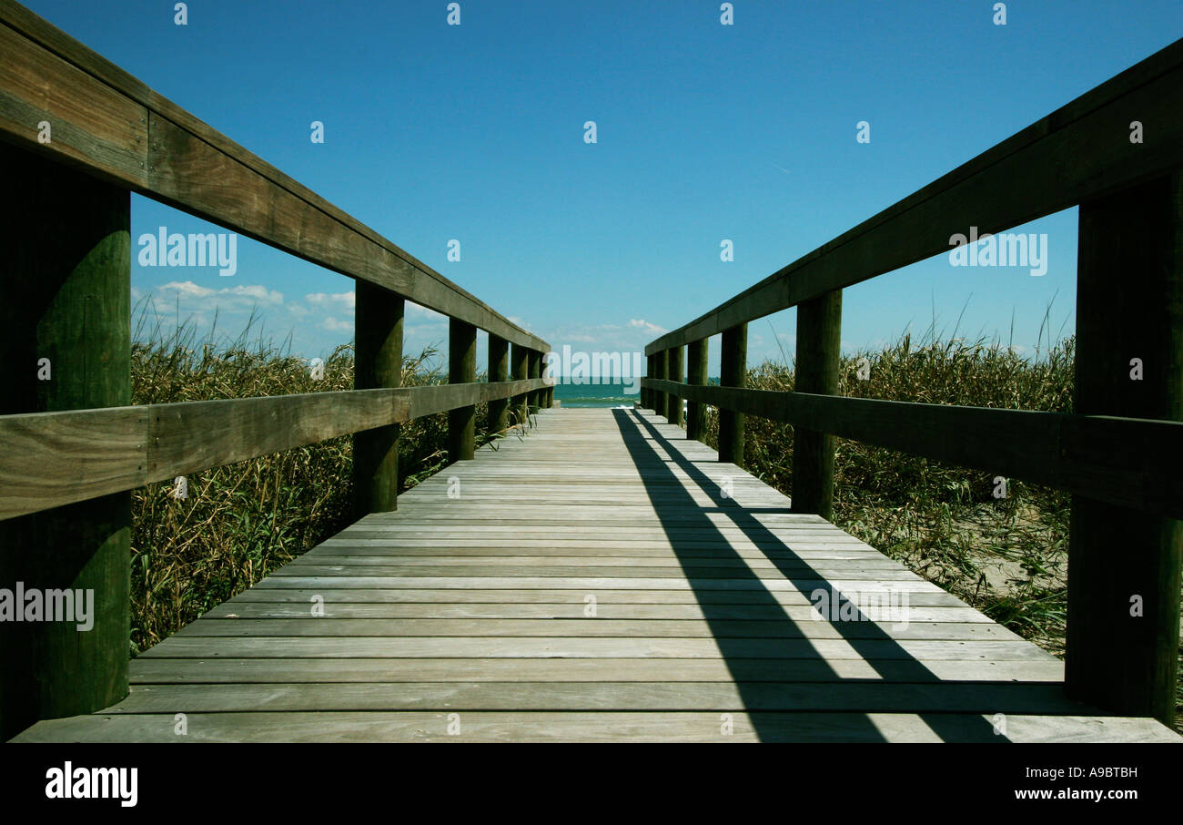 Wooden pathway leading down to a beautiful beach Stock Photo - Alamy