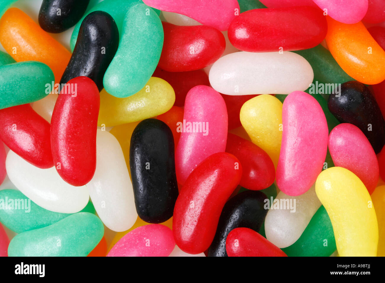 Multi colored jelly beans background close up Stock Photo - Alamy