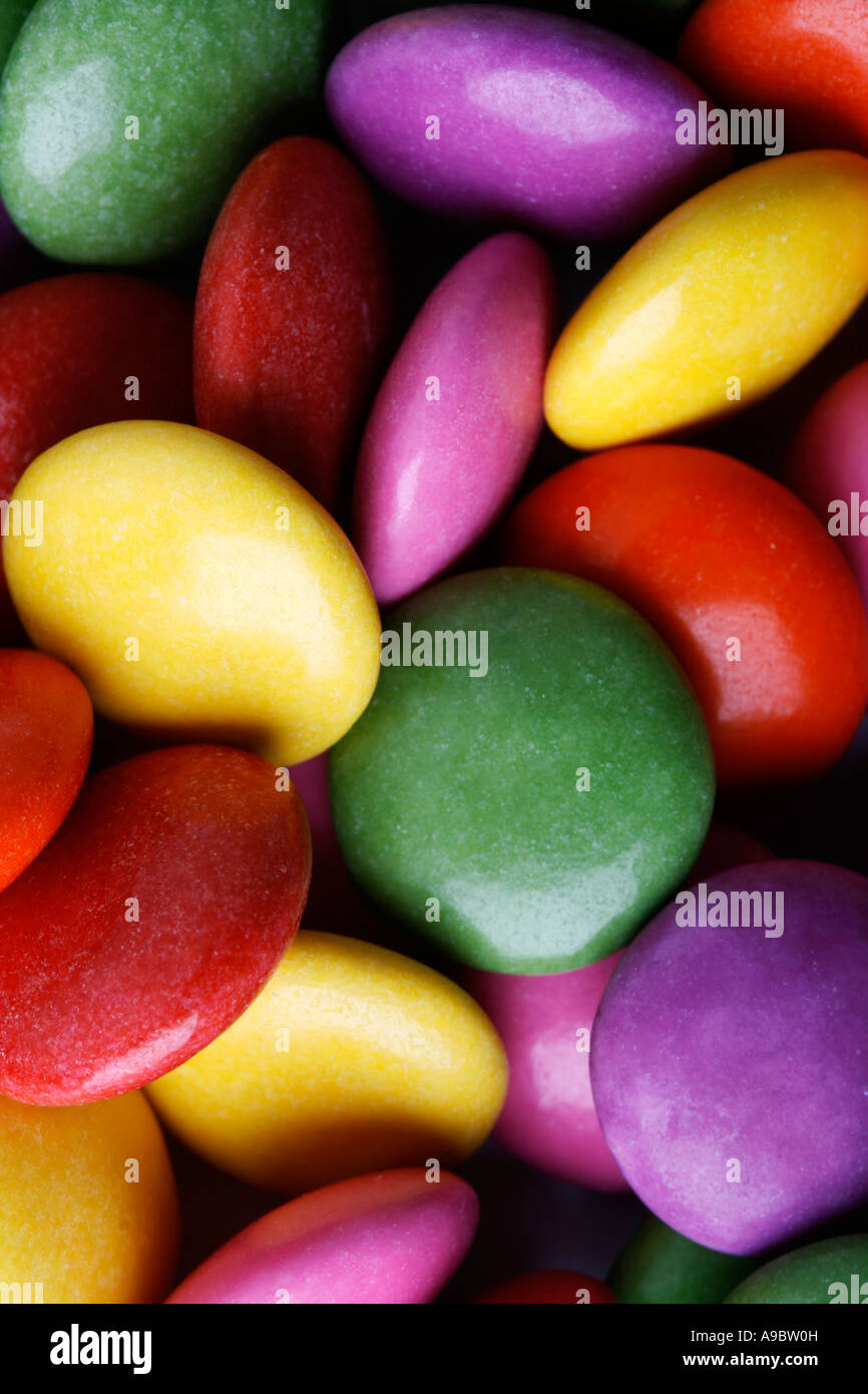 Close up background of multi colored smarties candy Stock Photo - Alamy