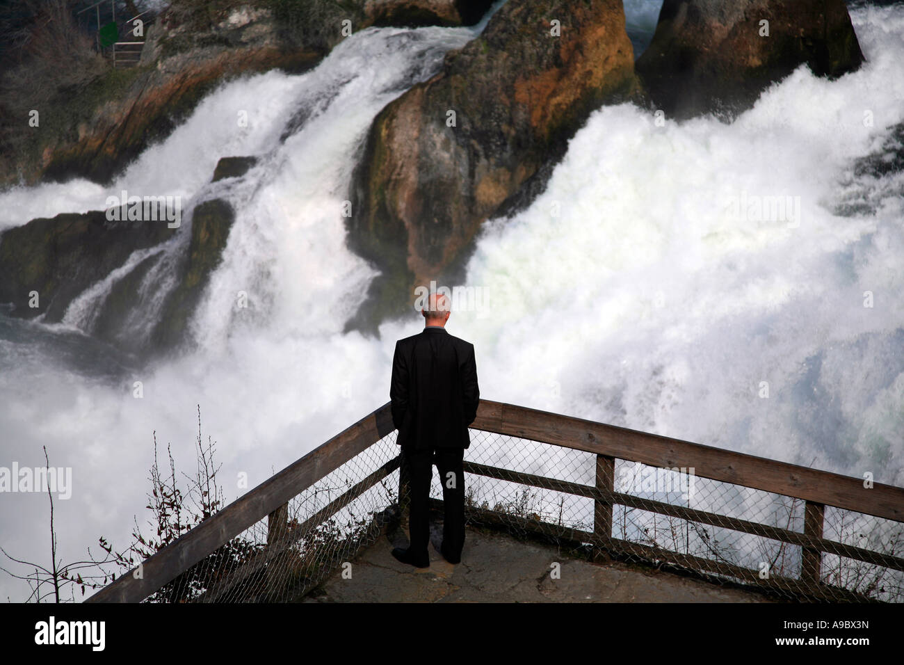 Man watching Rheinfall waterfall in Switzerland Stock Photo - Alamy