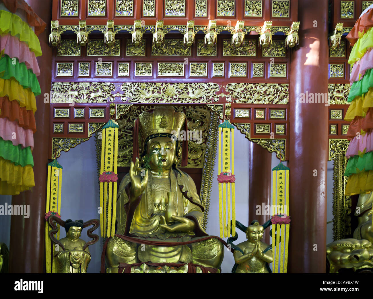 CHINA BEIJING Golden giant statues of the Buddha surrounded by ...