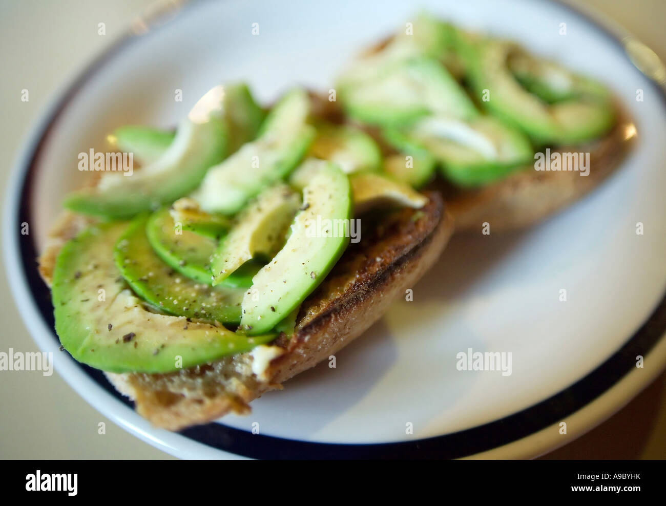 Sliced avocado on toasted brown bap Stock Photo - Alamy