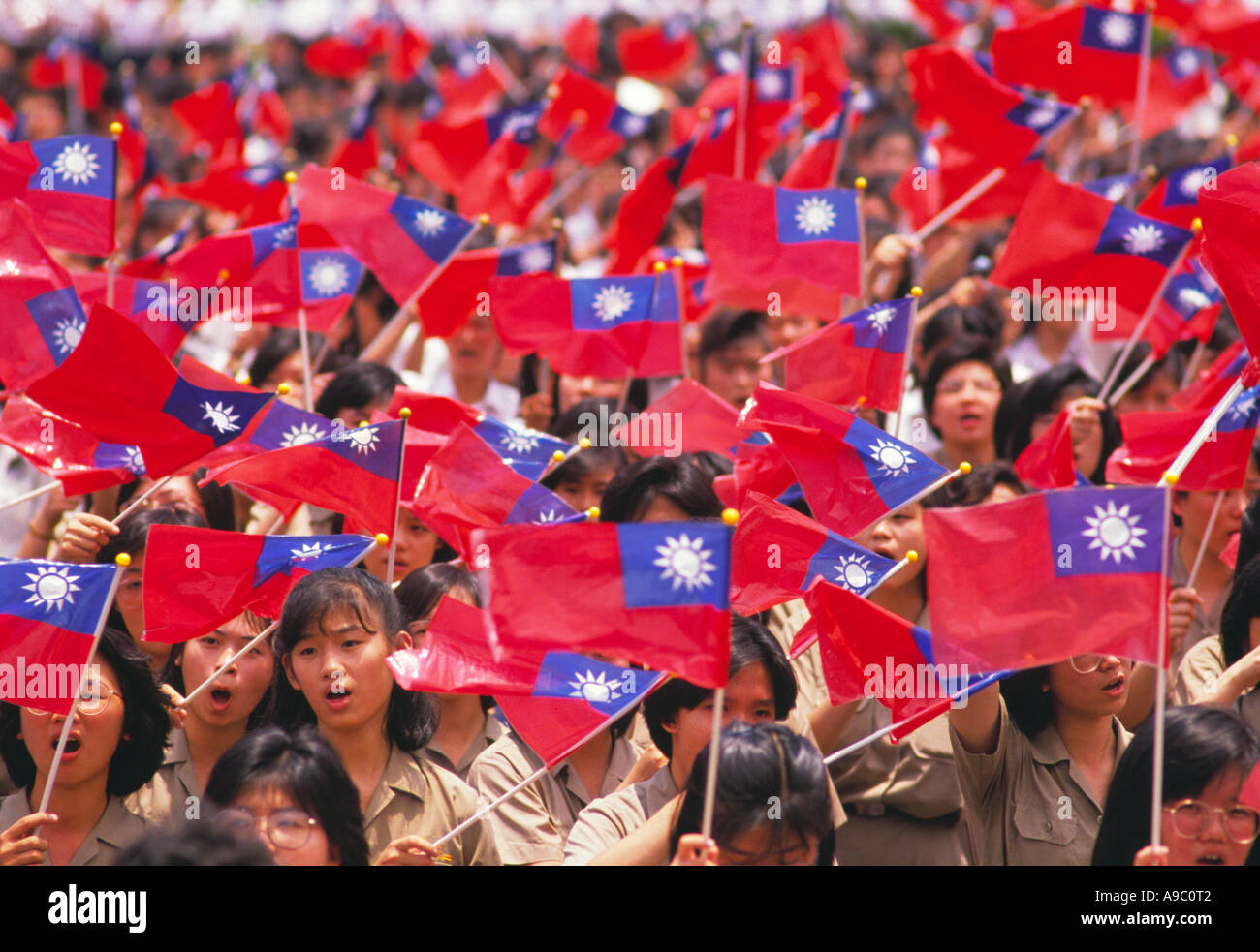 pupils and students celebrate national day waving the national flag ...