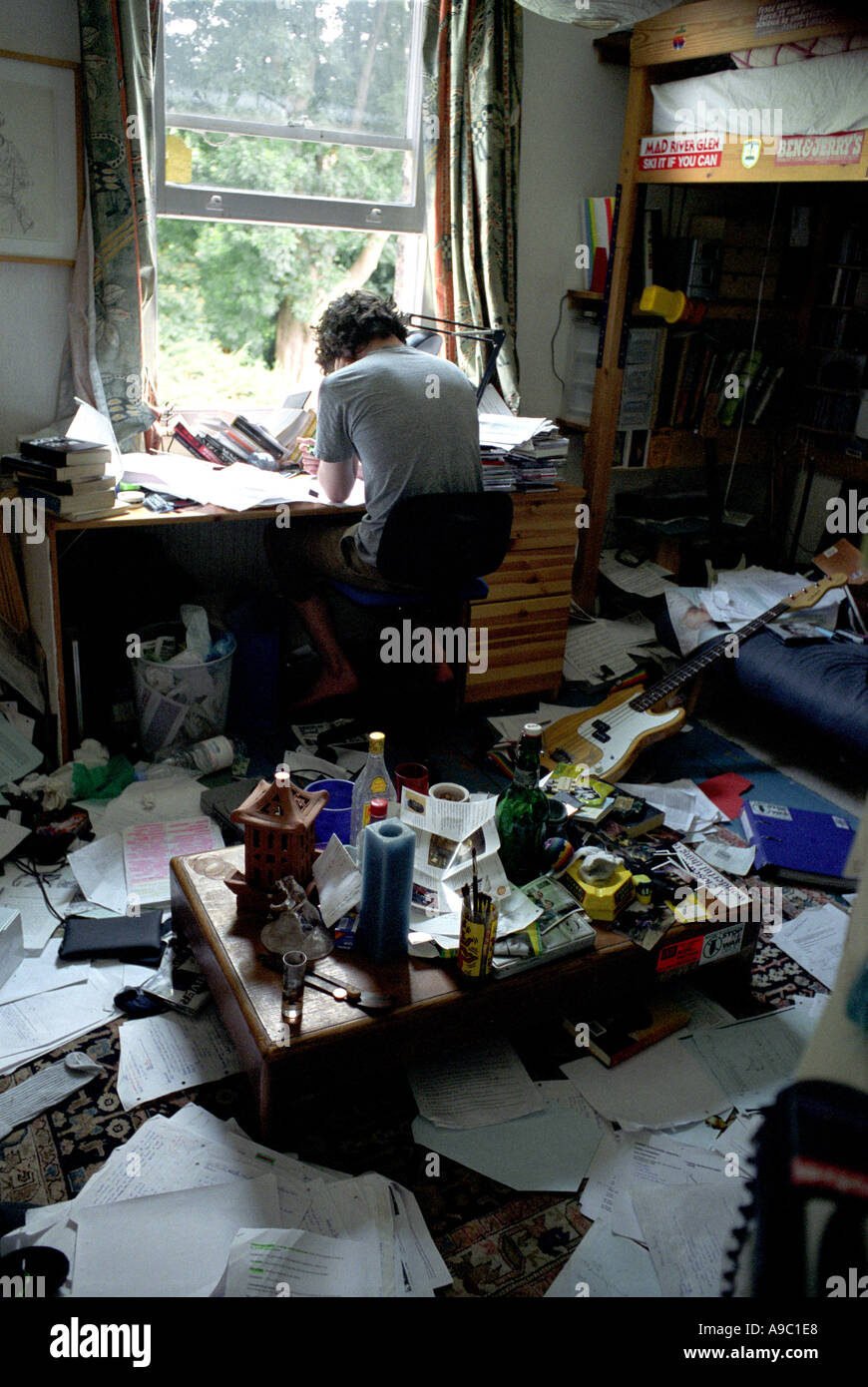 Teenage boy studying in his very messy bedroom Stock Photo - Alamy