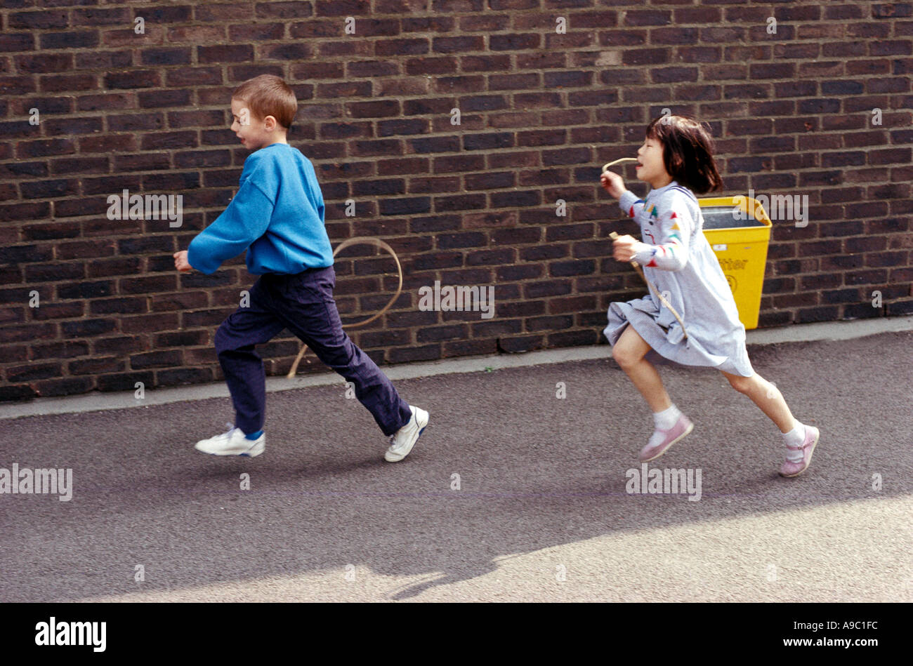 Kids Playing Tag On Playground