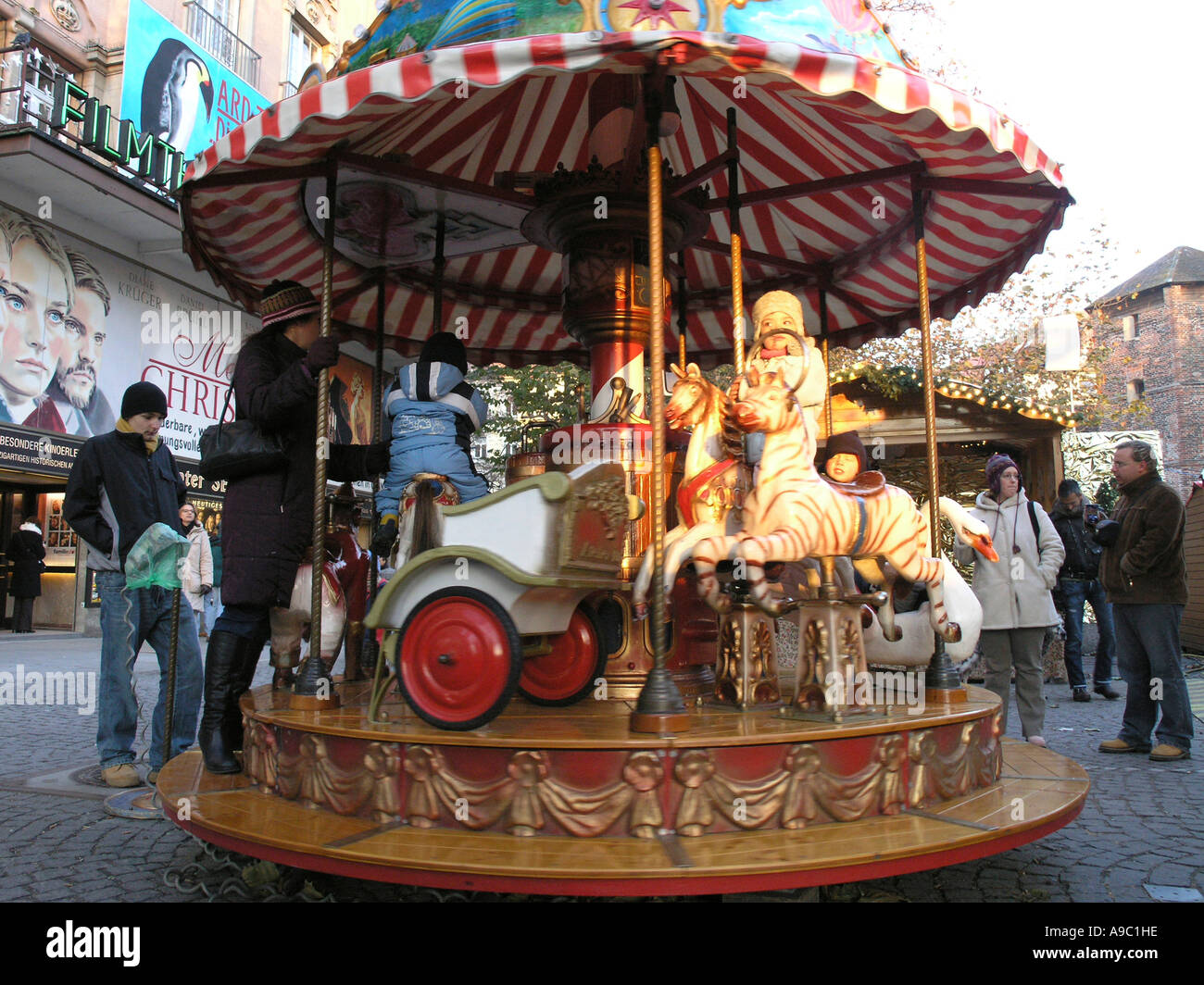 Carousel in Christmas market Munich Germany Stock Photo - Alamy