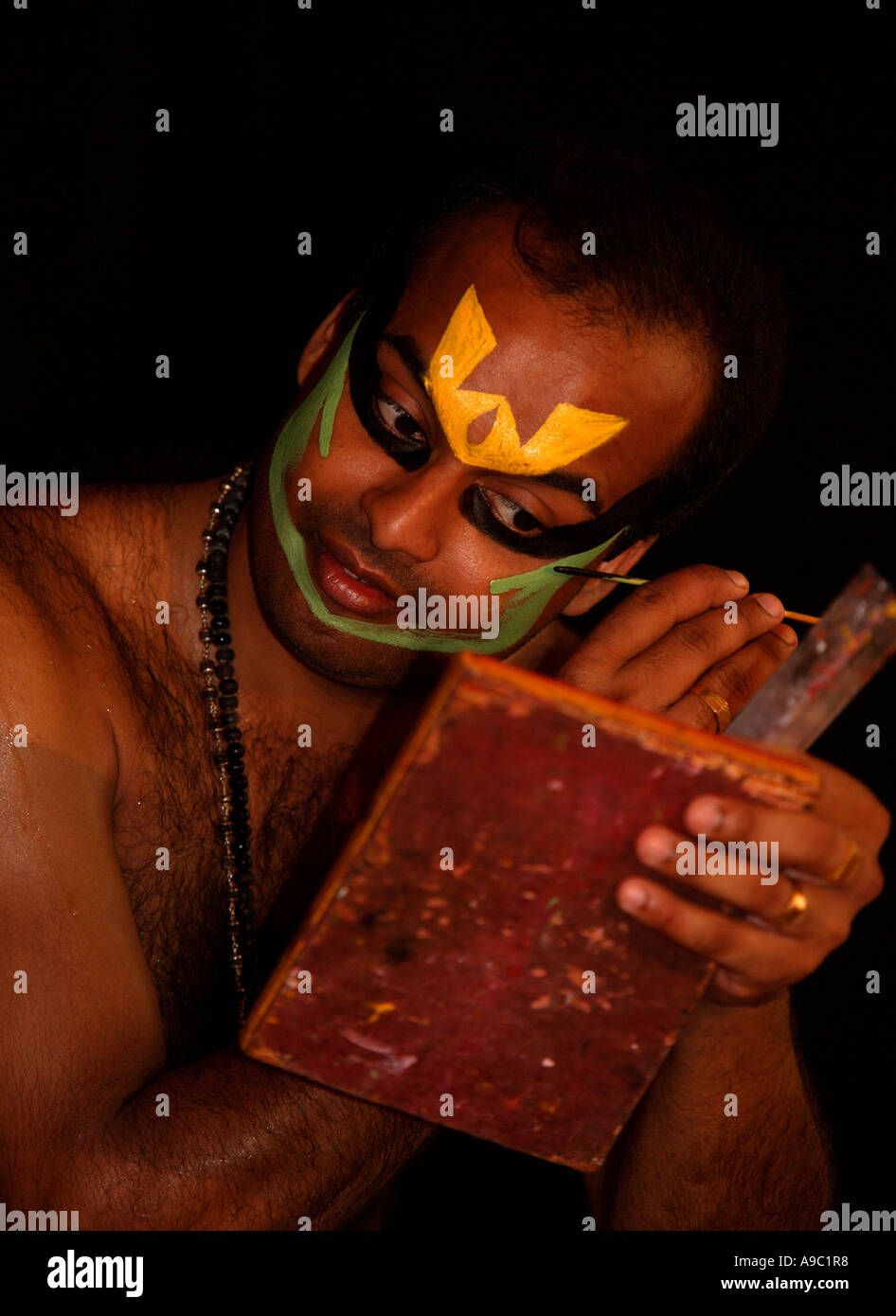 Katakali Dancer applying his make-up, Kerala, South India Stock Photo ...