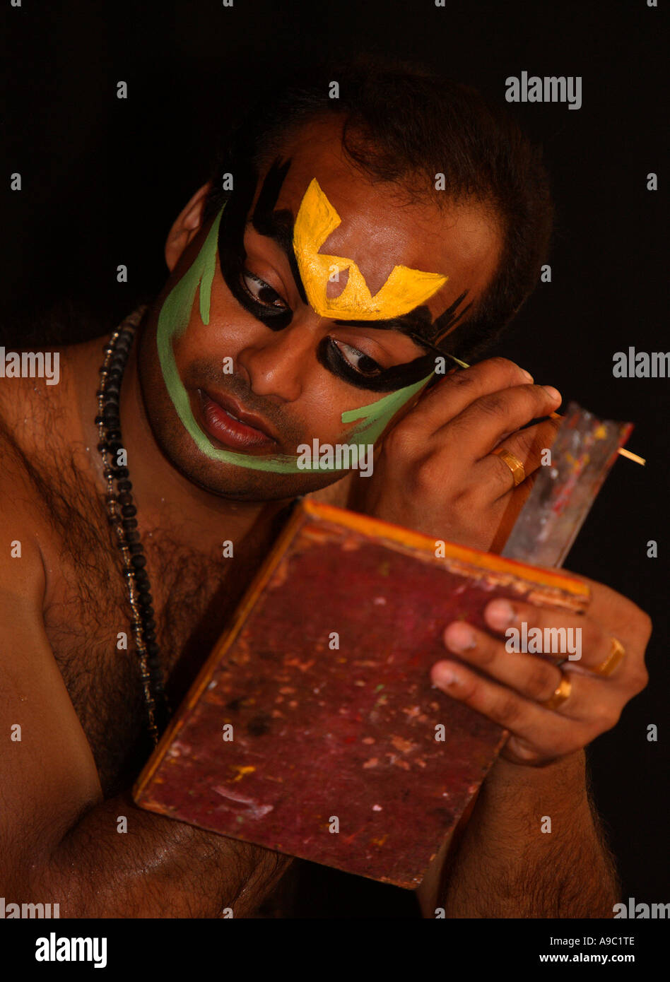 Katakali Dancer applying his make-up, Kerala, South India Stock Photo ...