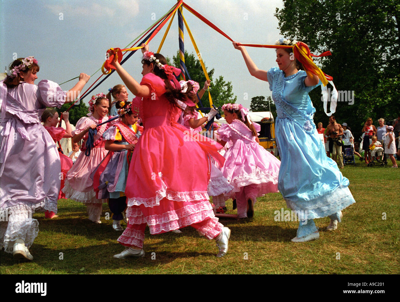 Children dancing around the Maypole at a summer fair in Dulwich park ...
