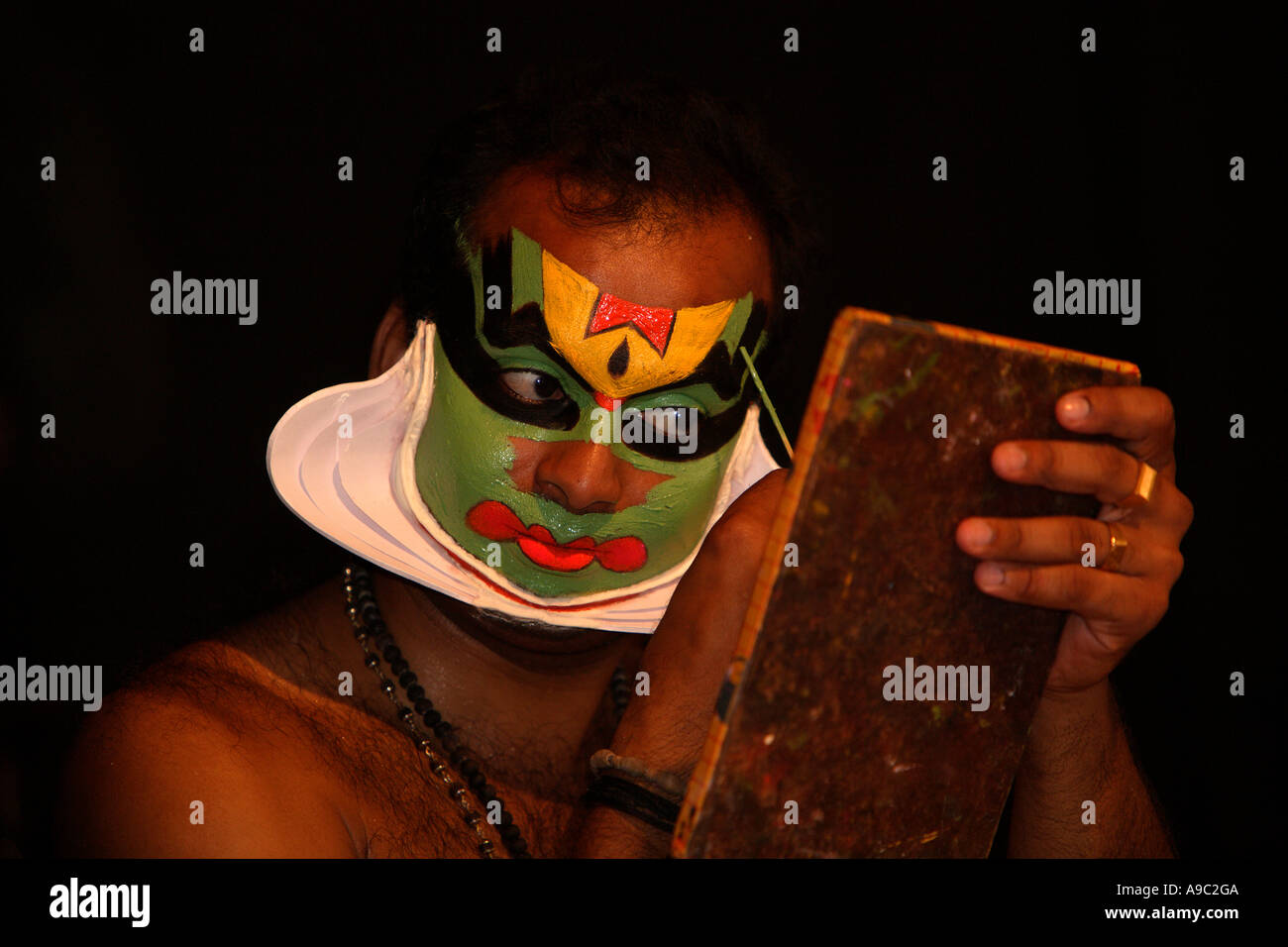 Katakali Dancer applying his make-up, Kerala, South India Stock Photo ...