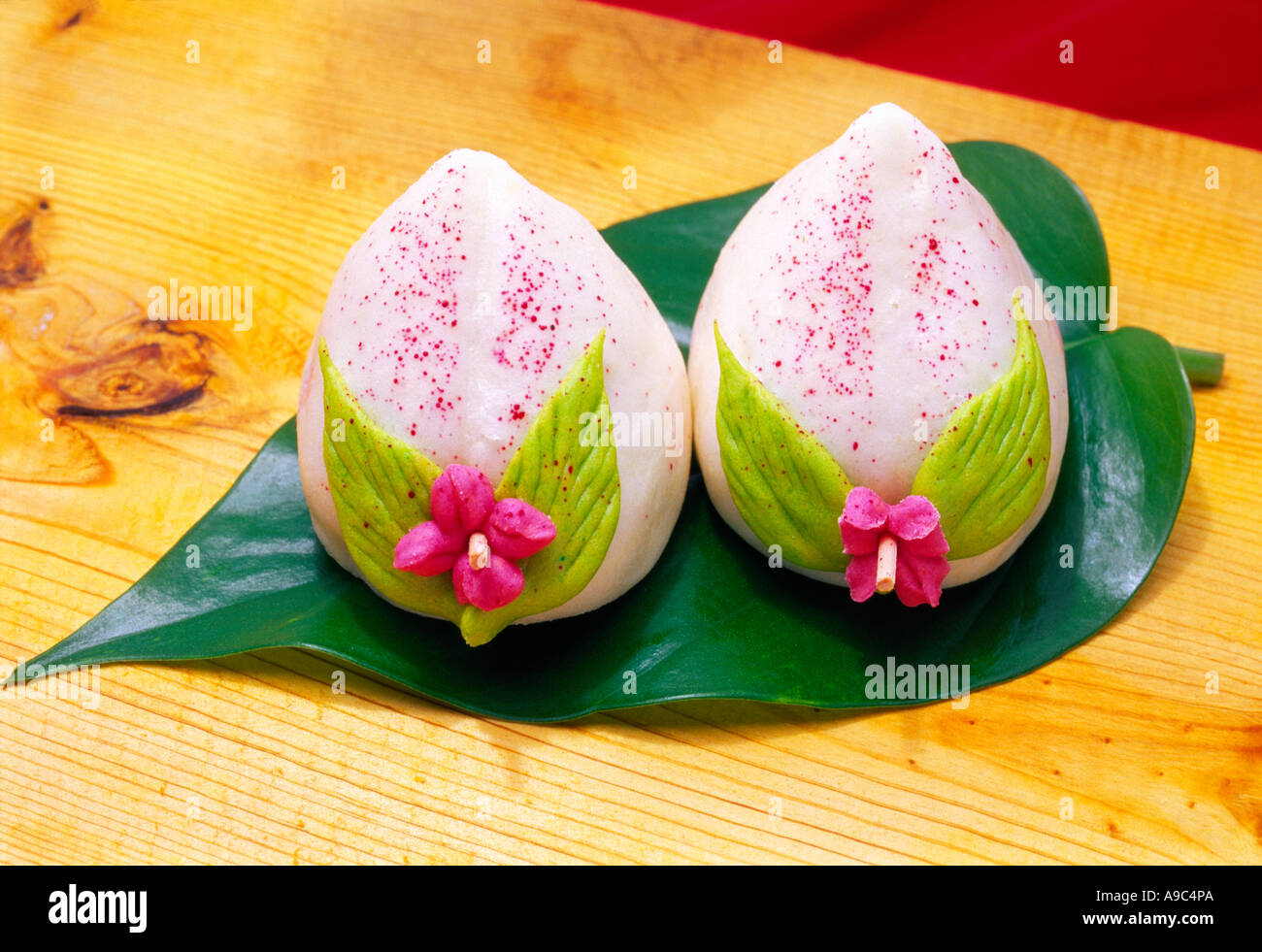 Dimsum longevity peaches presented to another on his birthday Stock ...