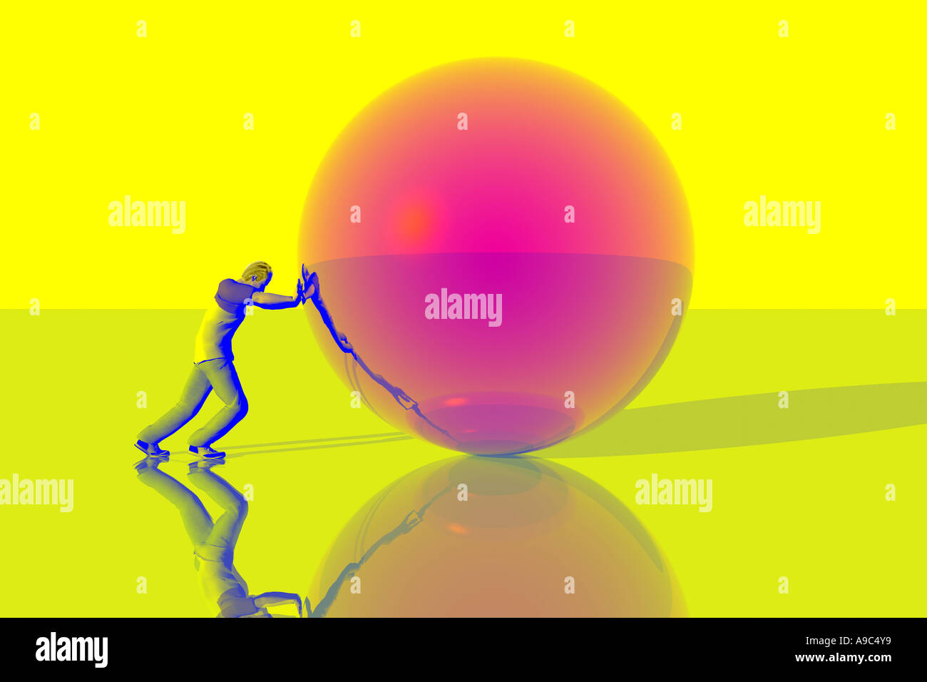 Man pushing a red ball Stock Photo - Alamy