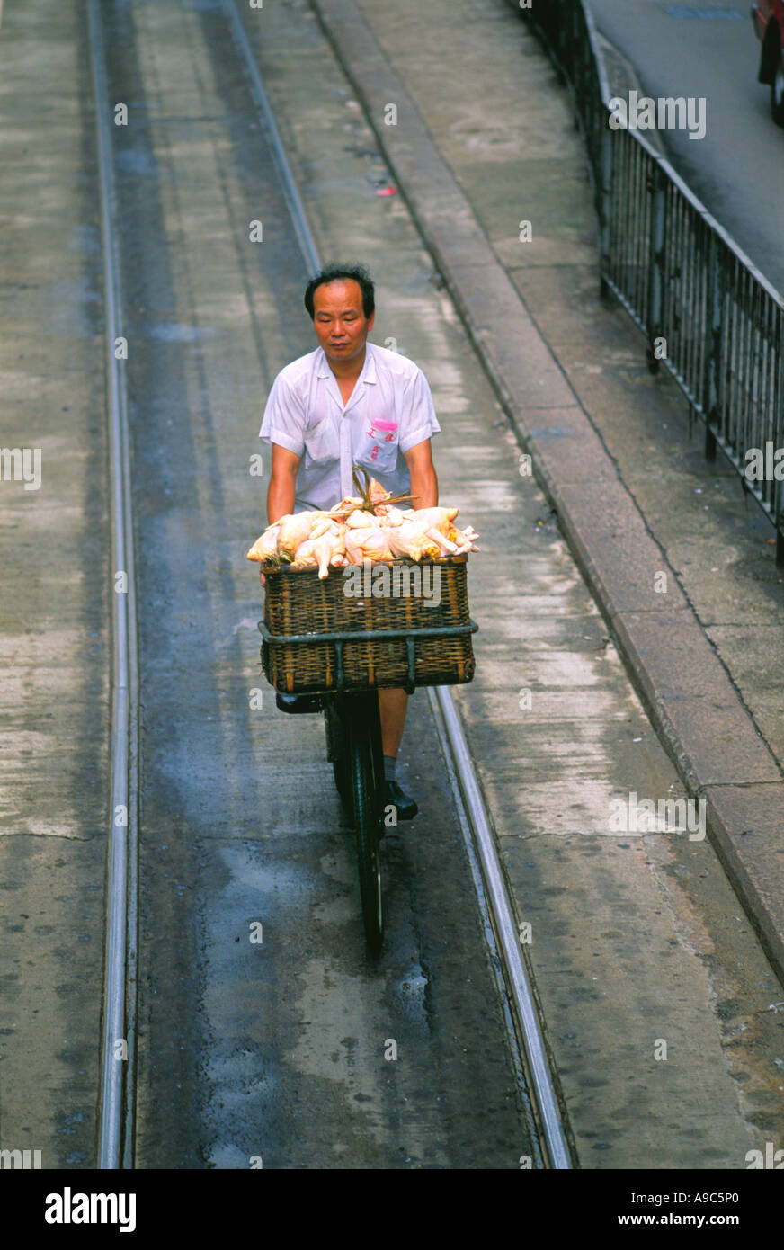 Cyclist deliver fresh chicken in the city of hong kong china Stock ...