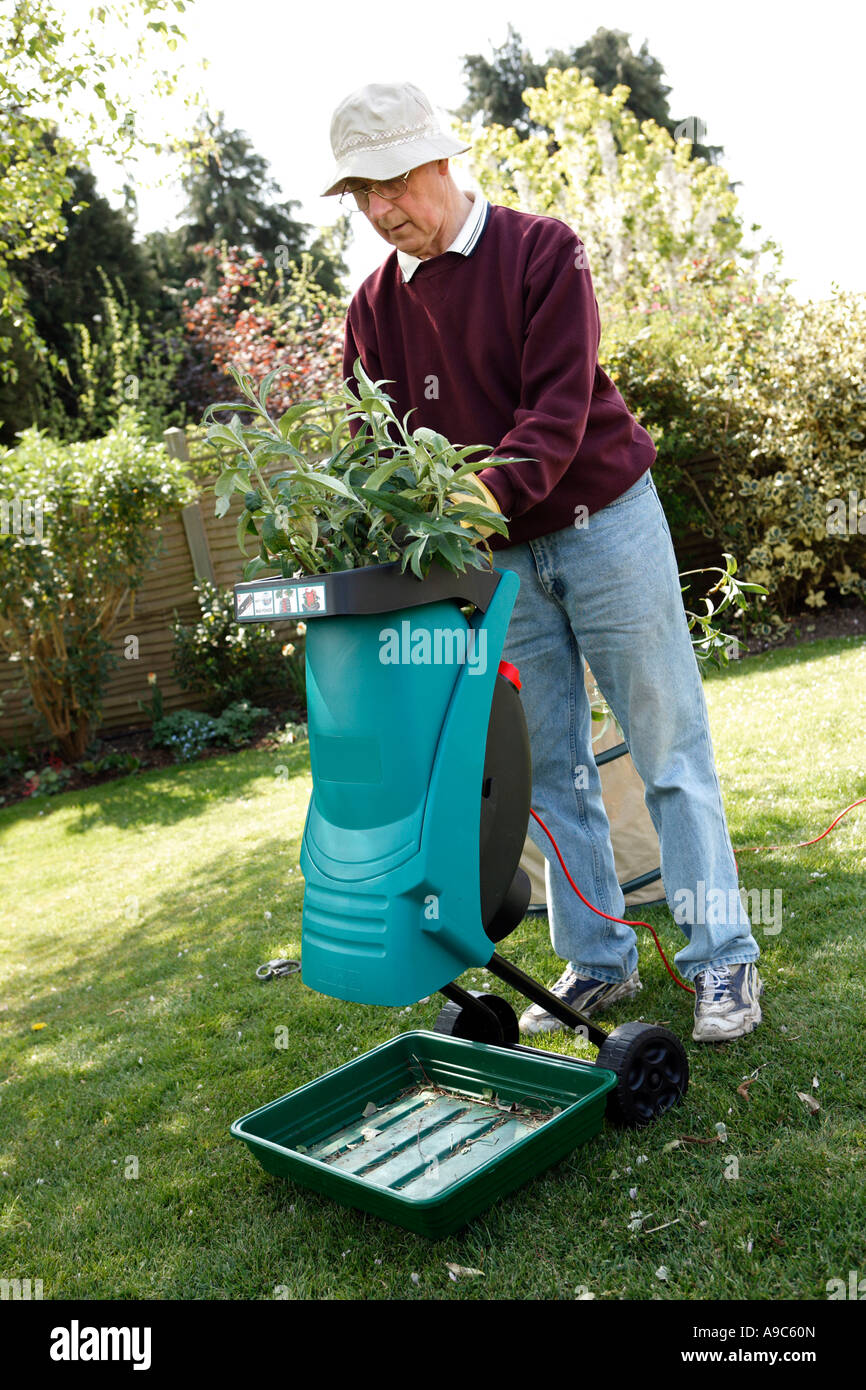 Gardener Using Shredder Stock Photo - Alamy