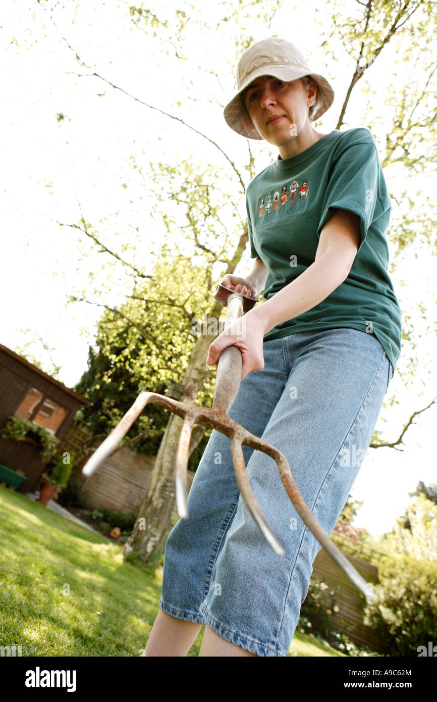 Female Gardener with Garden Fork Stock Photo - Alamy