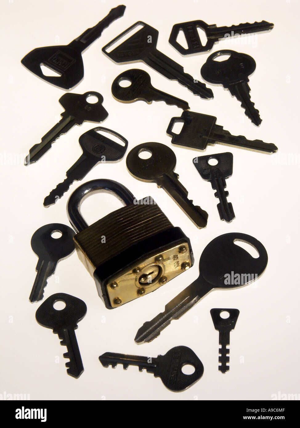 Collection of different keys with a padlock Stock Photo - Alamy