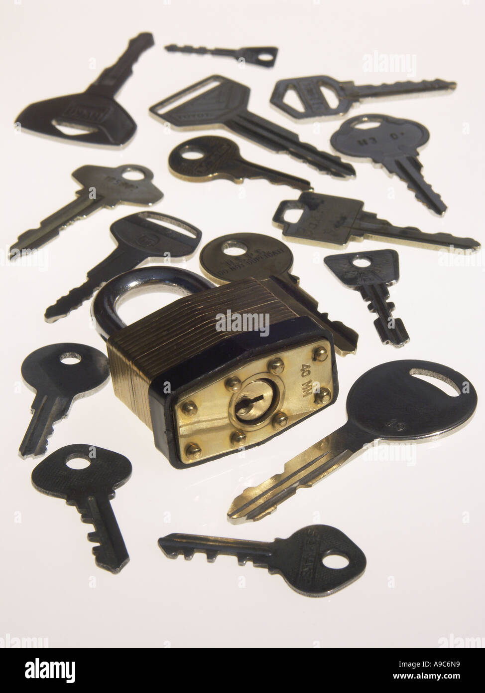 Collection of different keys with a padlock Stock Photo - Alamy
