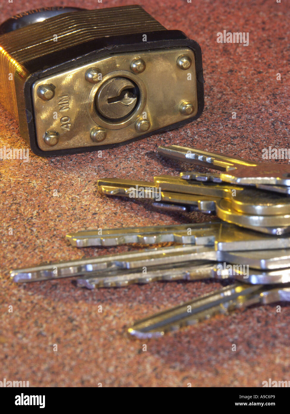 Collection of different keys with a padlock Stock Photo - Alamy
