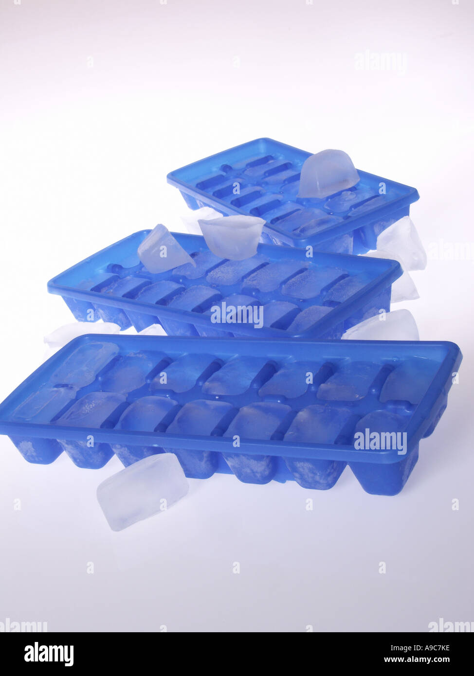 Ice cubes with blue trays Stock Photo - Alamy