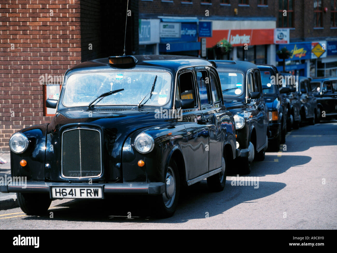 British taxi cabs line up hi-res stock photography and images - Alamy