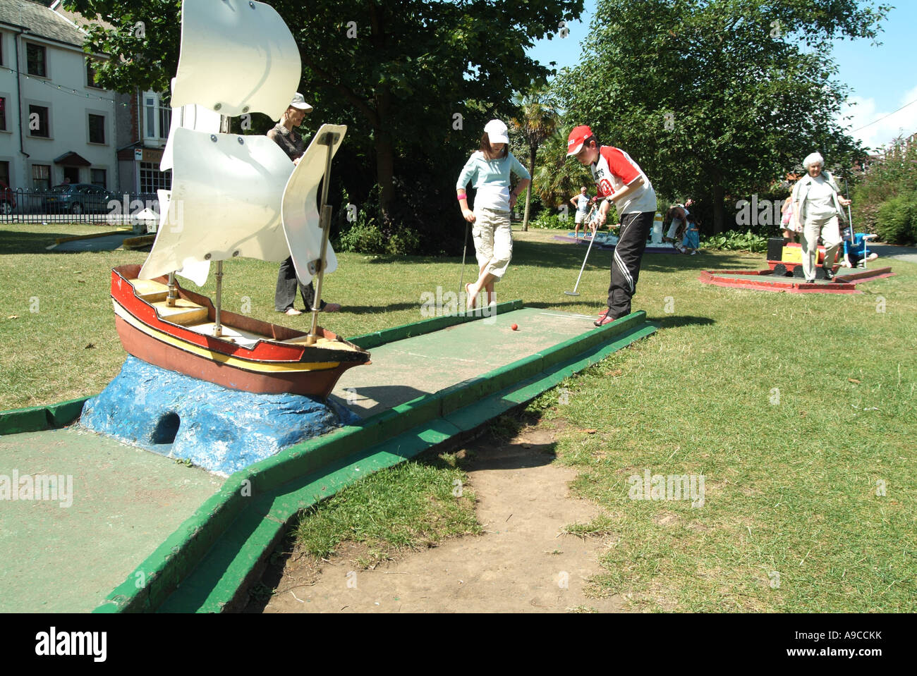 Family Playing Crazy Golf Mumbles Stock Photo - Alamy