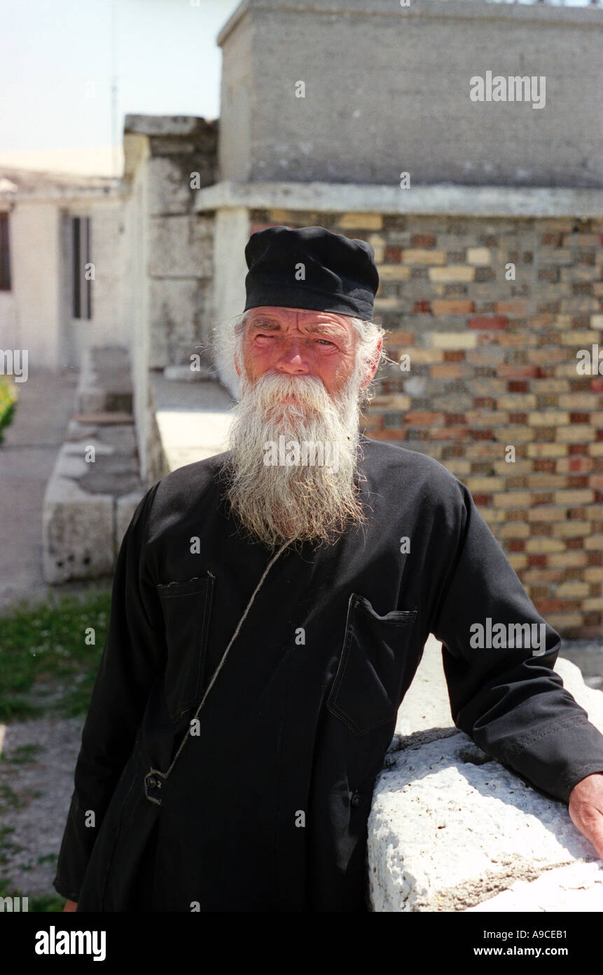 Greek priest in costume Stock Photo - Alamy