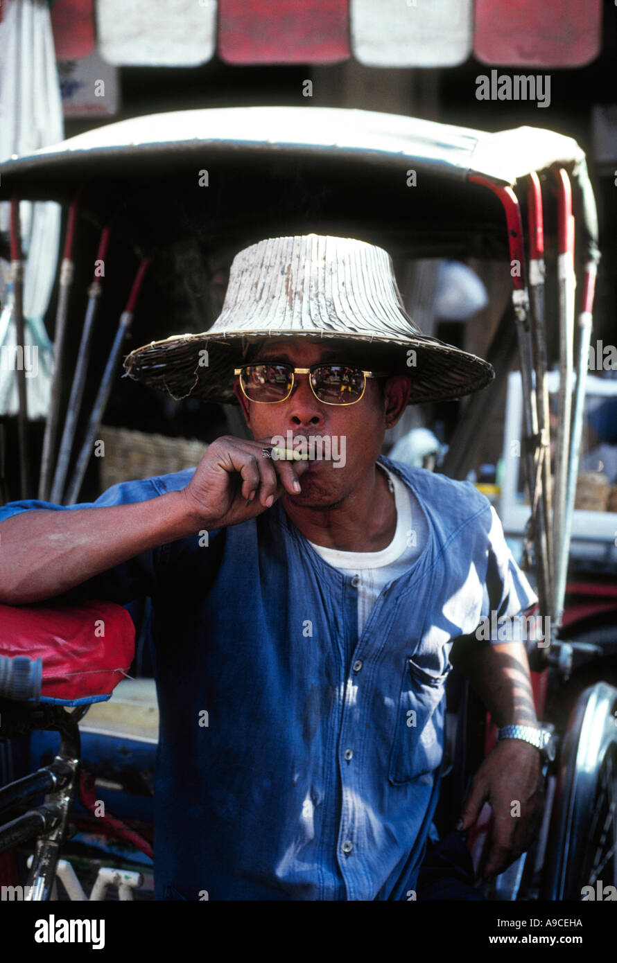 Rickshaw driver smoking hi-res stock photography and images - Alamy