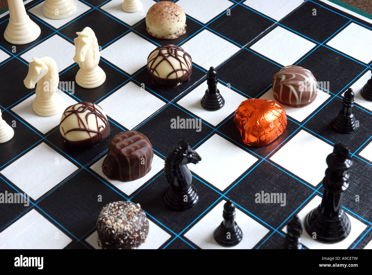 Fancy chocolates on a chess board Stock Photo - Alamy