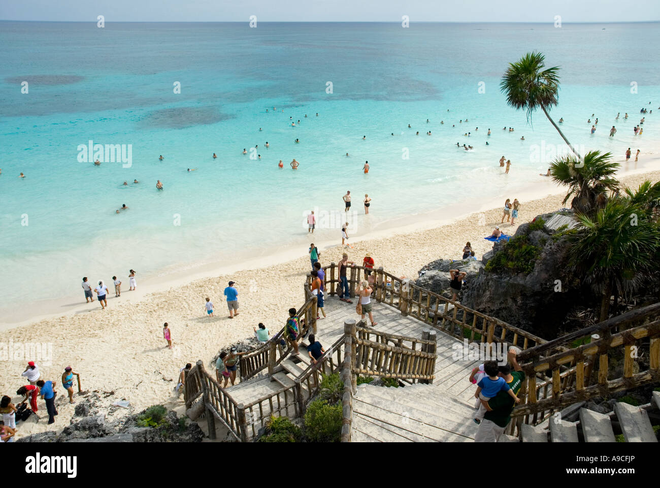 Tulum people having a bath near the ruins and stairs Stock Photo - Alamy