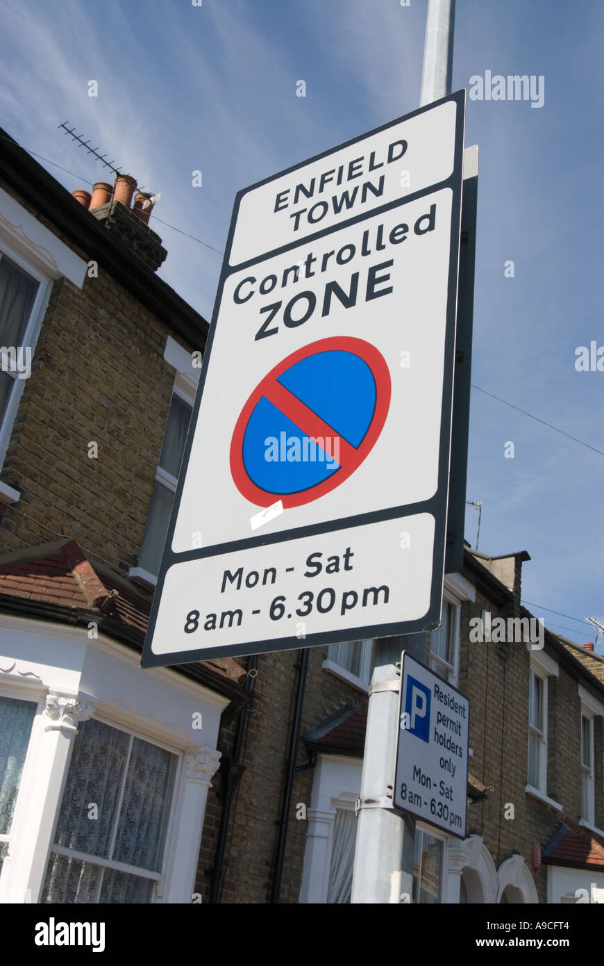 Traffic sign indicating times of parking in a controlled zone ...