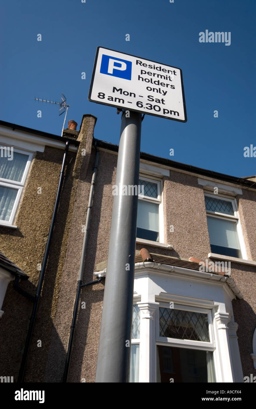 Traffic sign indicating times of parking in a controlled zone ...