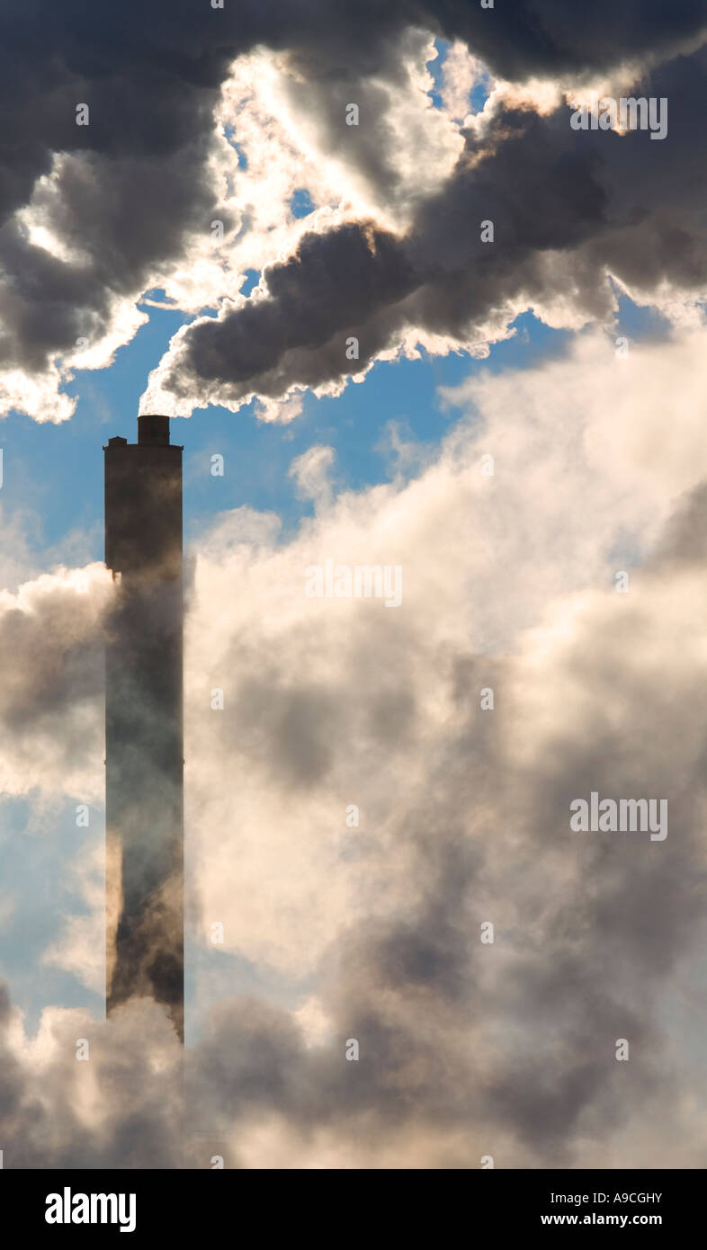 Smokestack in the middle of clouds spilling out dark smoke , Finland ...