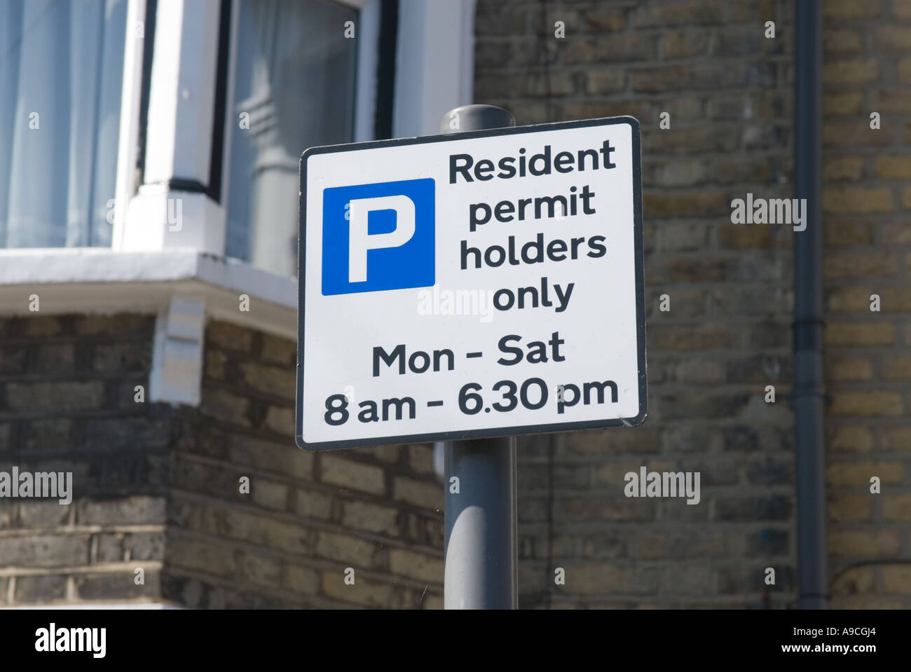 Traffic sign indicating times of parking in a controlled zone ...