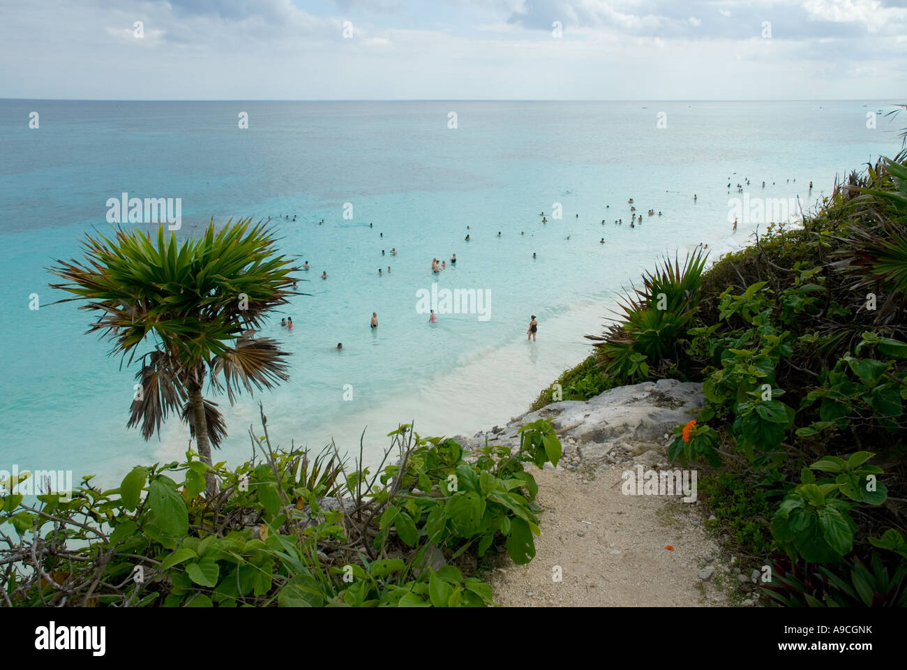 Tulum people having a bath near the ruins and stairs Stock Photo - Alamy