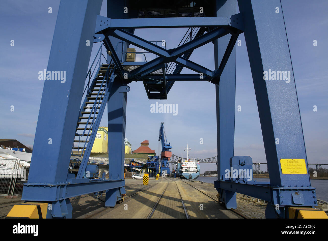 Cargo ship at harbour Suspension railway train Metal bridge Rendsburg ...