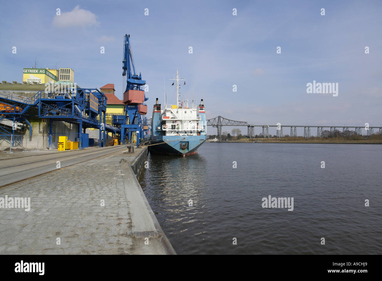 Cargo ship at harbour Suspension railway train Metal bridge Rendsburg ...