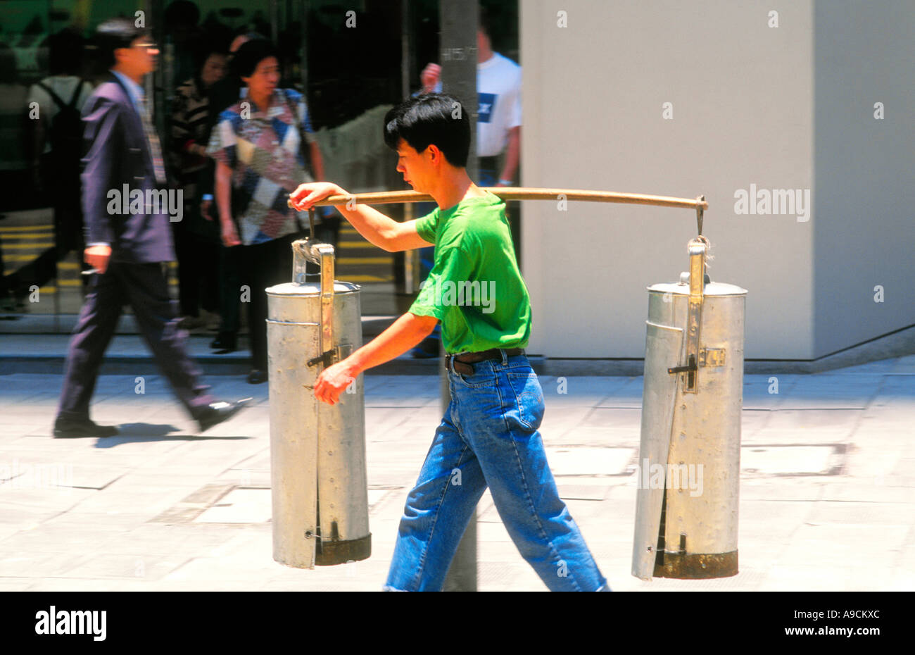 Man carrying lunch metal boxes in Central district Hong Kong china ...