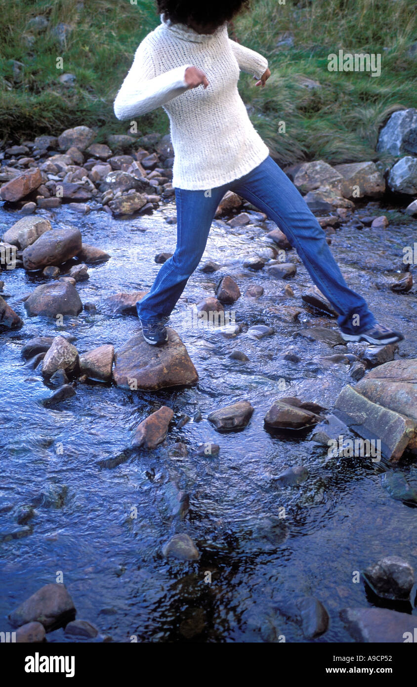 Women Jumping Stream Stock Photo - Alamy