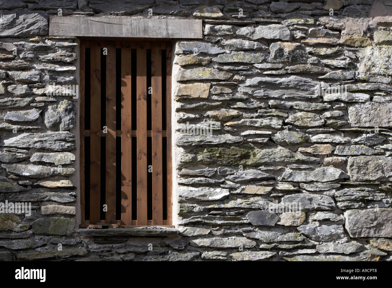 barn in Cumbria with traditional door with ventilation slits Stock ...
