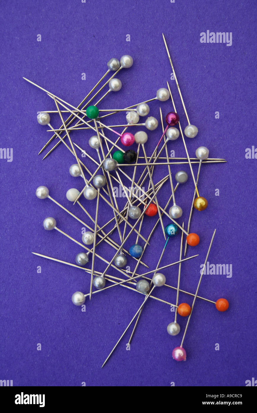 A BUNCH OF PINS ON A PURPLE BACKGROUND BAPD1521 Stock Photo - Alamy