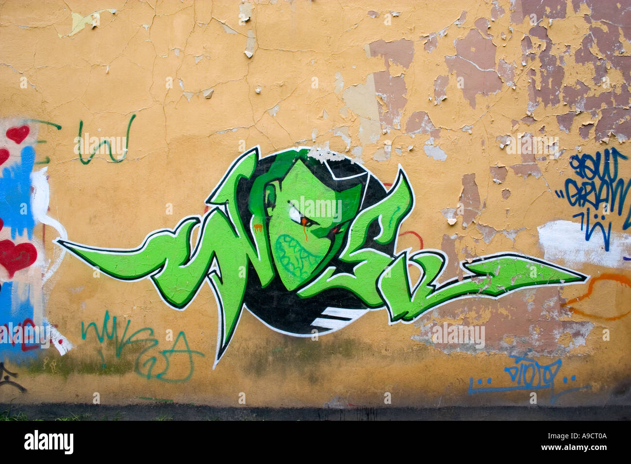 Graffiti green comic book caricature on building wall. Lodz Poland ...