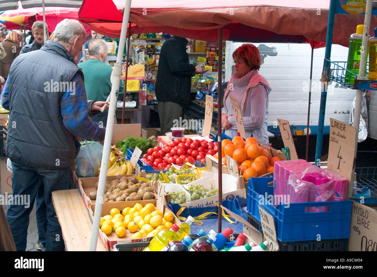 Shoppers selecting fresh produce at the Balucki Rynek market. Lodz ...