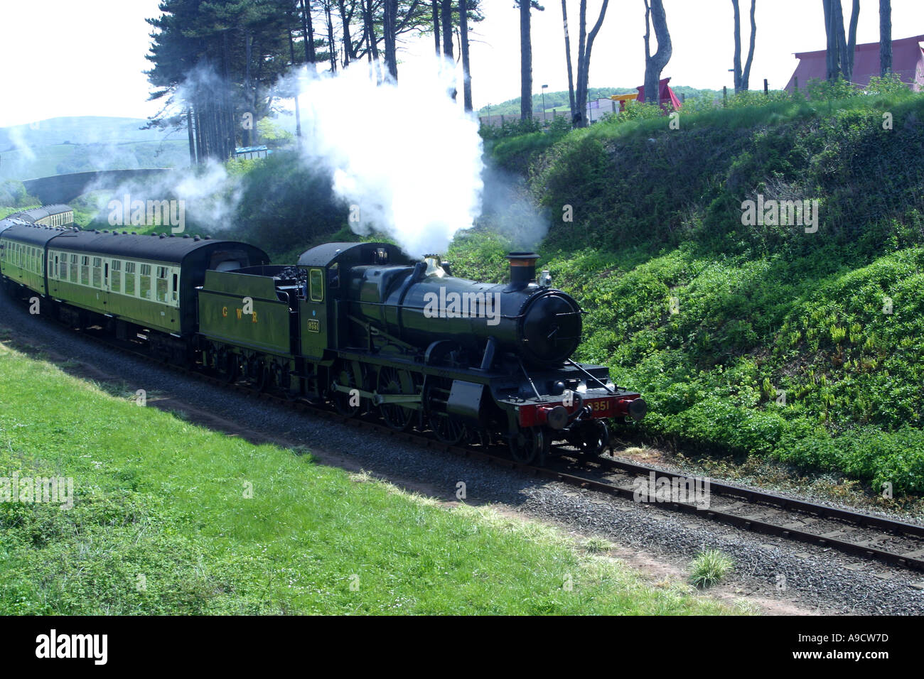 STEAM TRAIN HEADING INTO WATCHET SOMERSET STEAM RAILWAY ENGLAND Stock ...