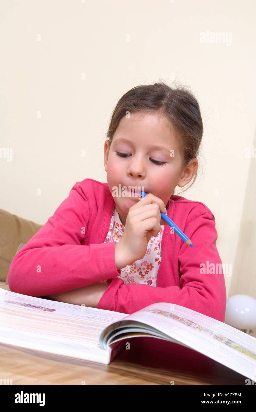 portrait of young girl doing her homework Stock Photo - Alamy